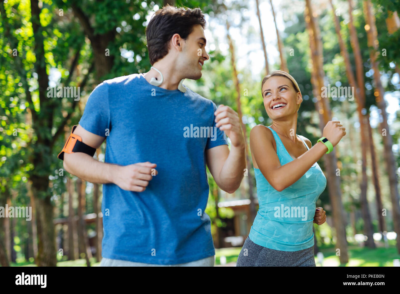 Joyful sportive people smiling to each other Stock Photo - Alamy