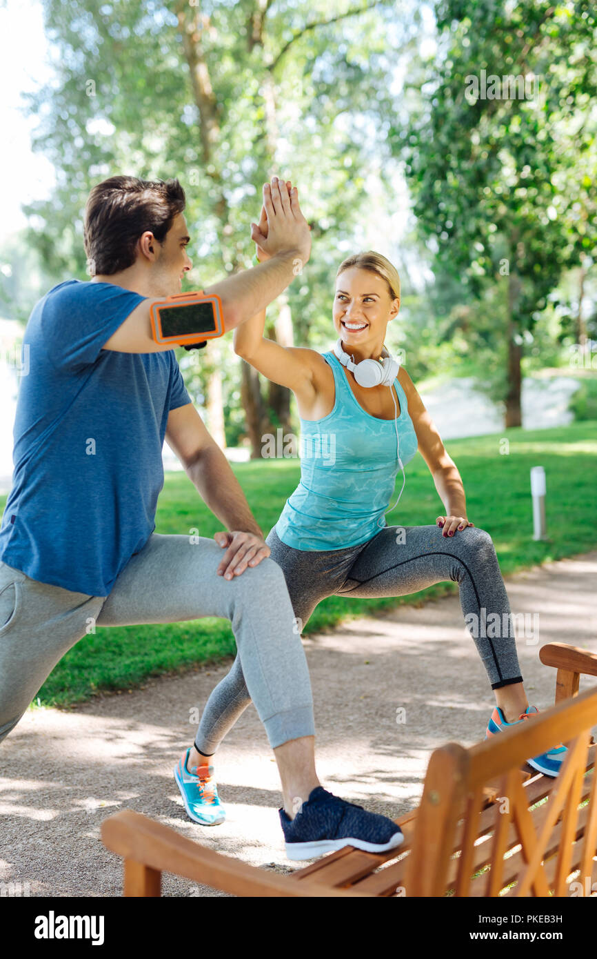 Sportive people doing exercise together hi-res stock photography and ...
