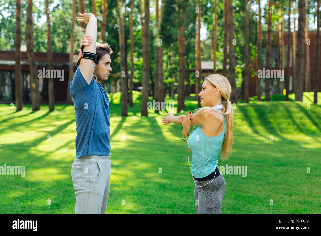 Nice positive people standing opposite each other Stock Photo - Alamy