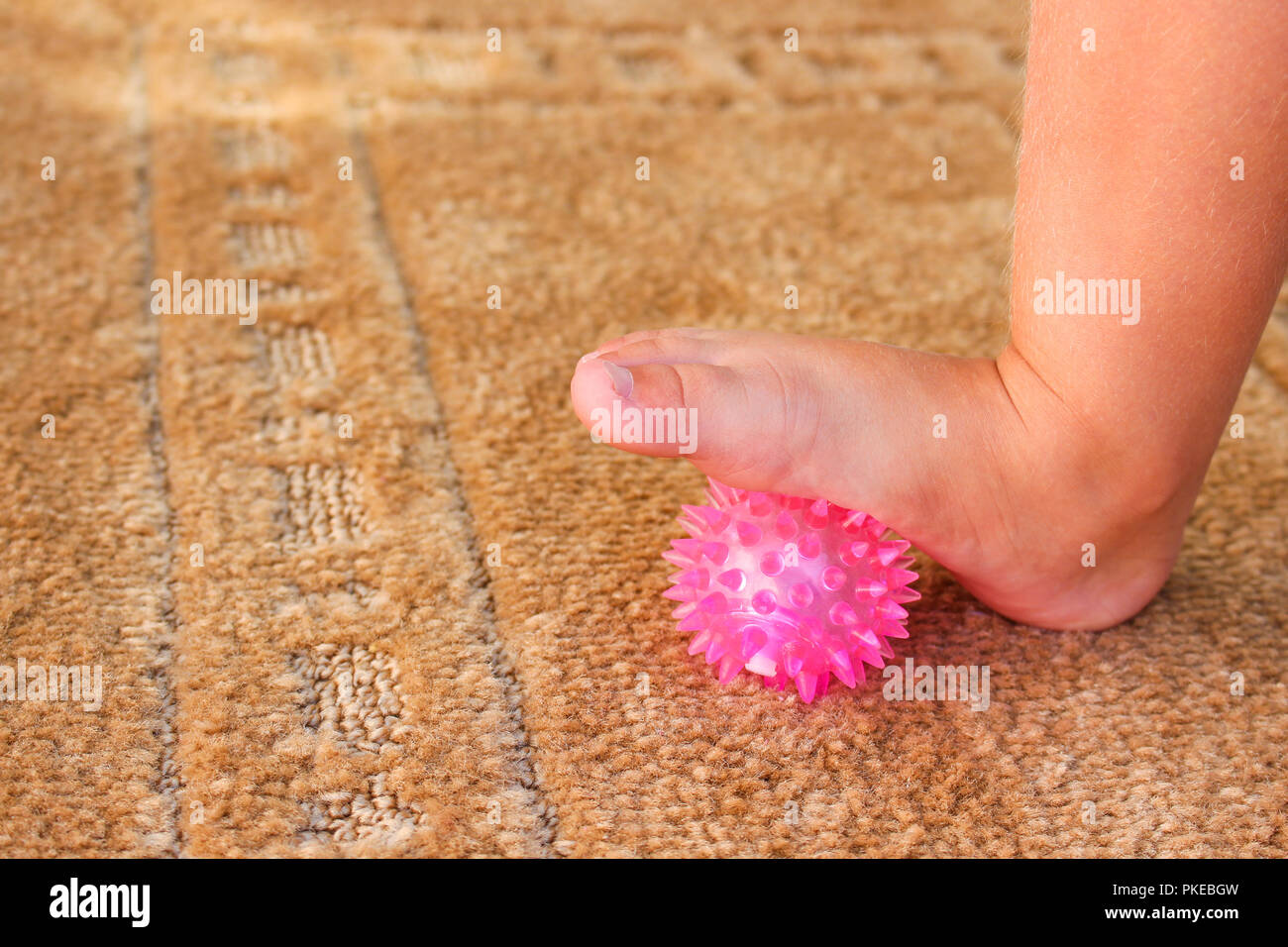 Children does exercise for foot massage ball Stock Photo - Alamy