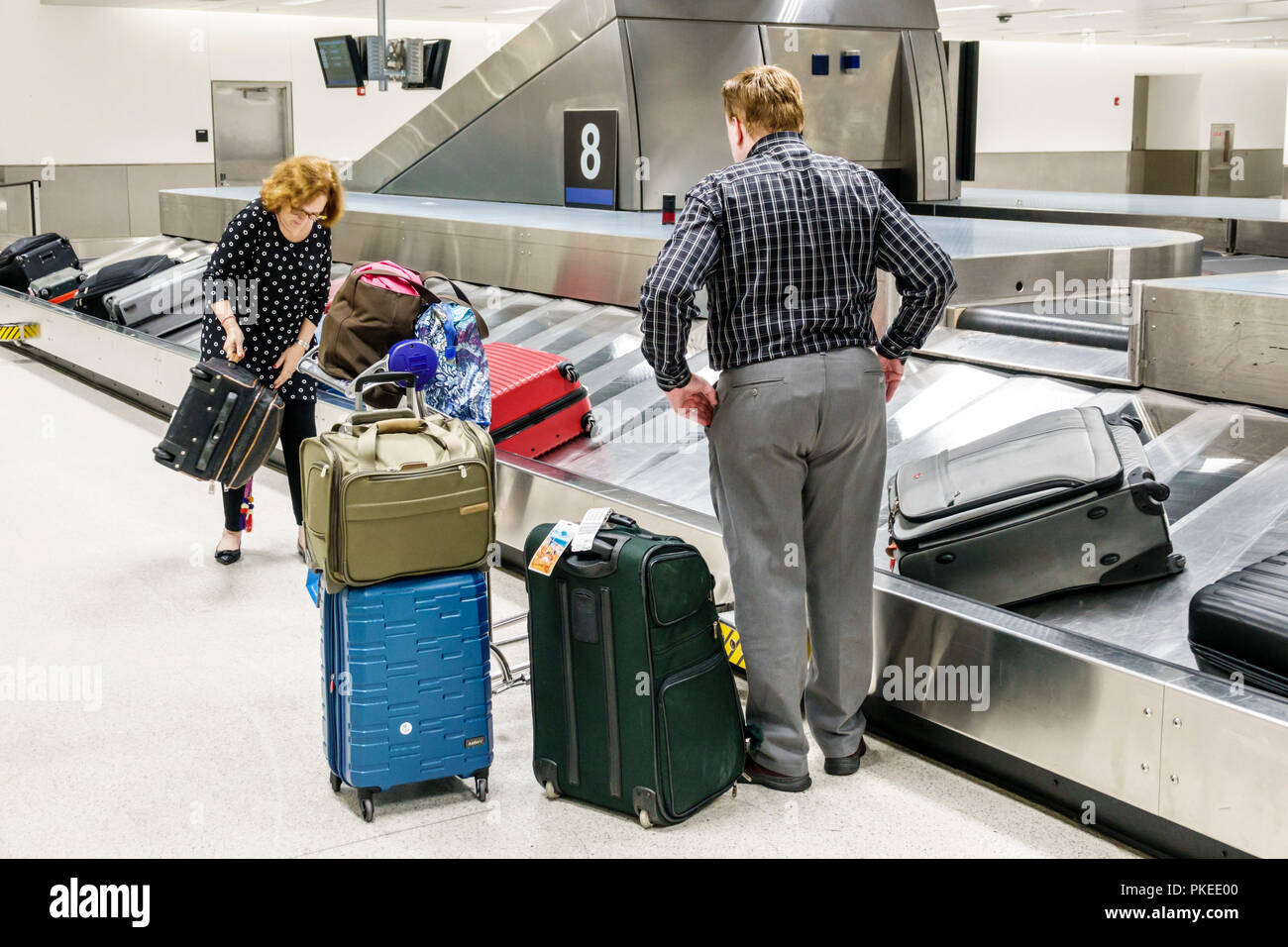 Airport Carousel Woman High Resolution Stock Photography and Images - Alamy