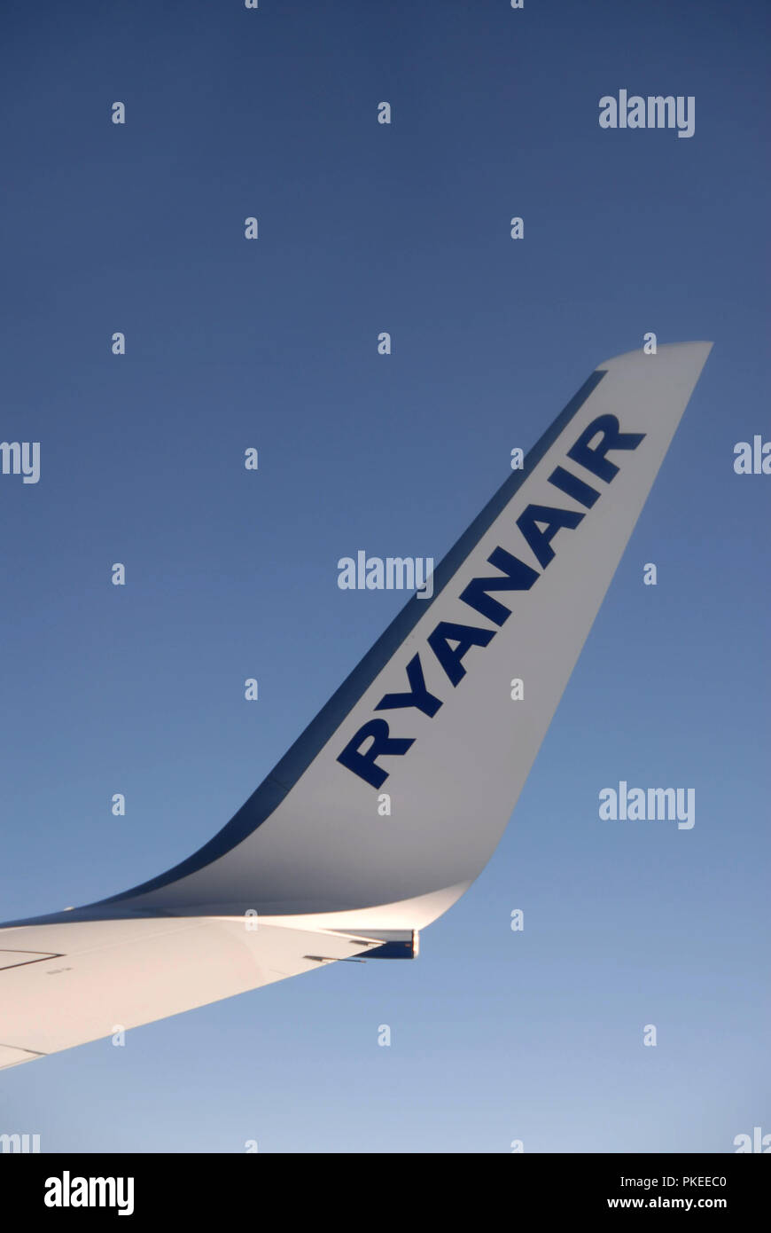 view out of a ryanair plane window showing closeup view of logo on ...