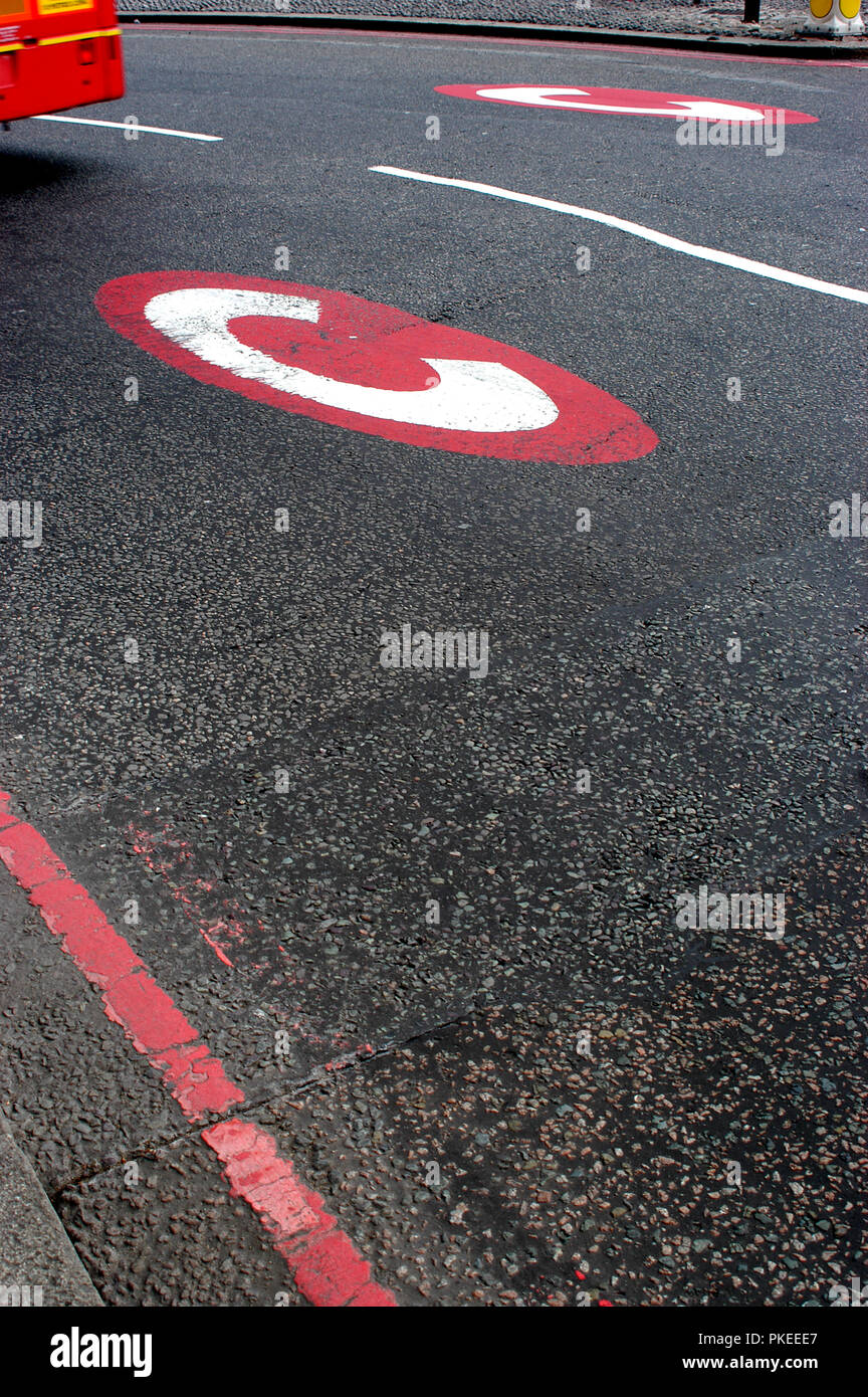 White C in red circle marked C on a road for Congestion Charge. Daily ...