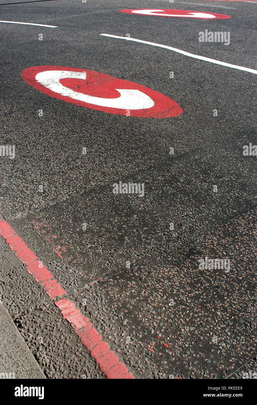 White C in red circle marked C on a road for Congestion Charge. Daily ...