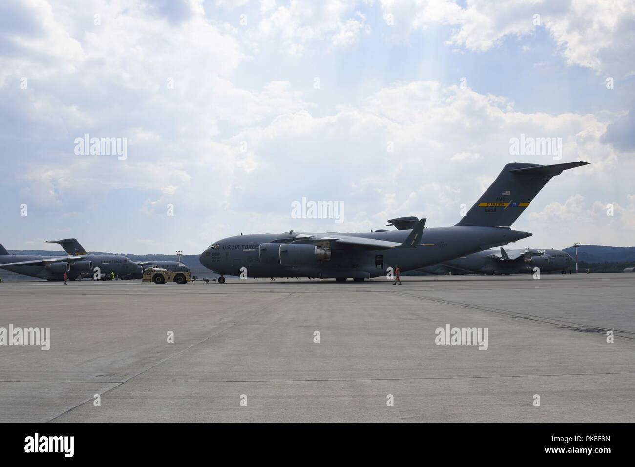 Chief Master Sgt. of the Air Force Kaleth O. Wright tows a C-17 ...