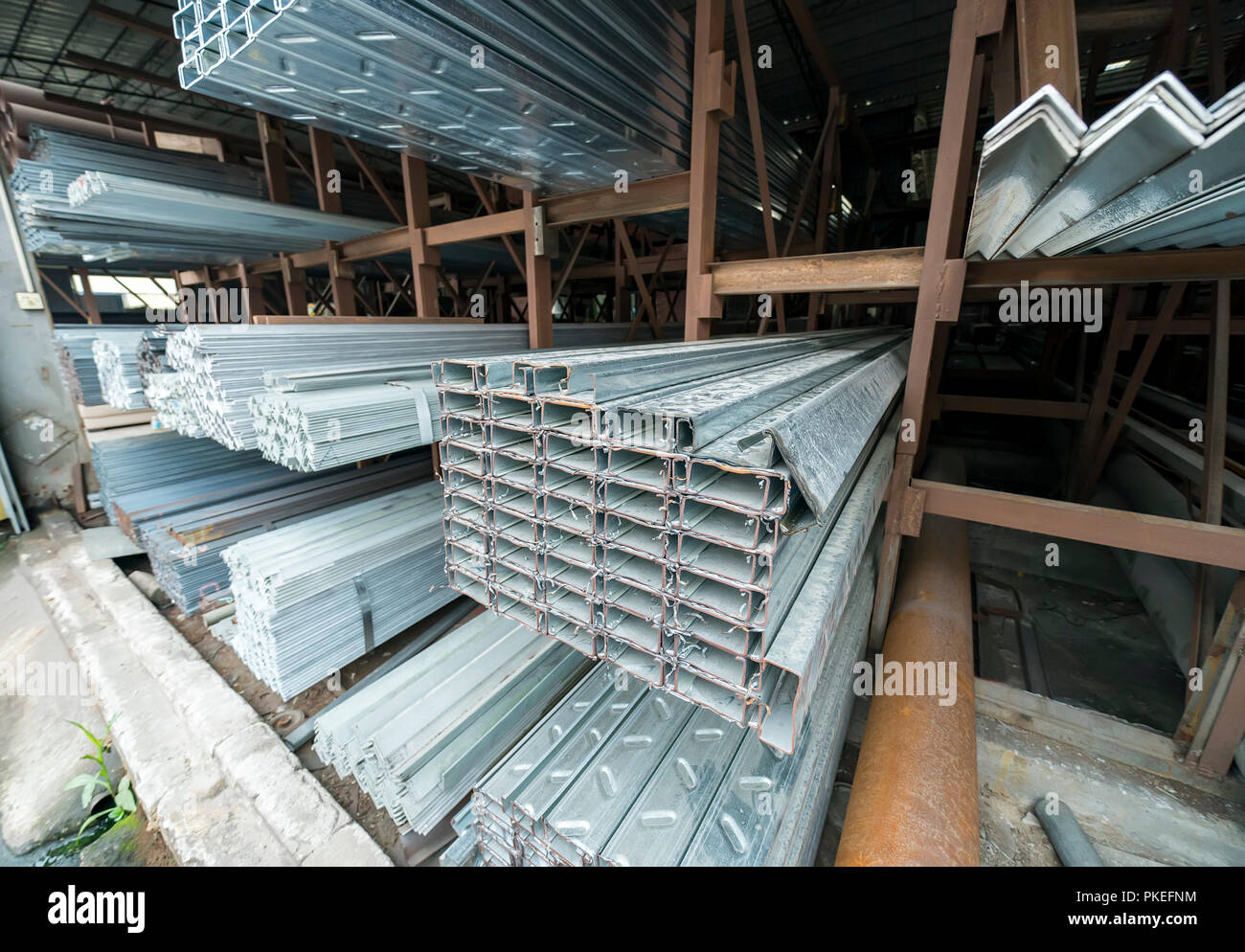 Steel angle on the rack in shop Stock Photo - Alamy