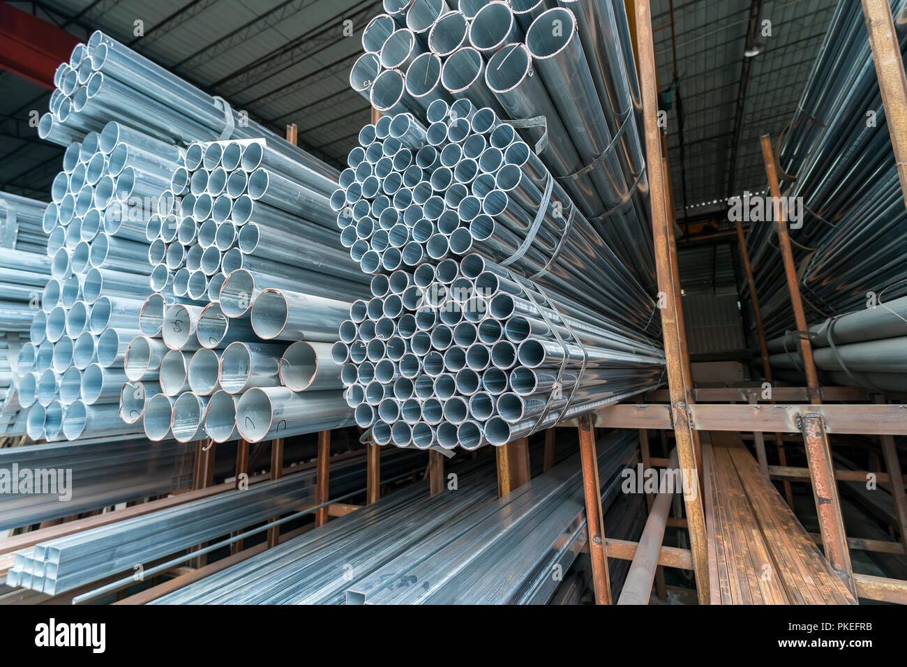 Steel Pipes Industry Construction stacked in Factory warehouse Stock ...