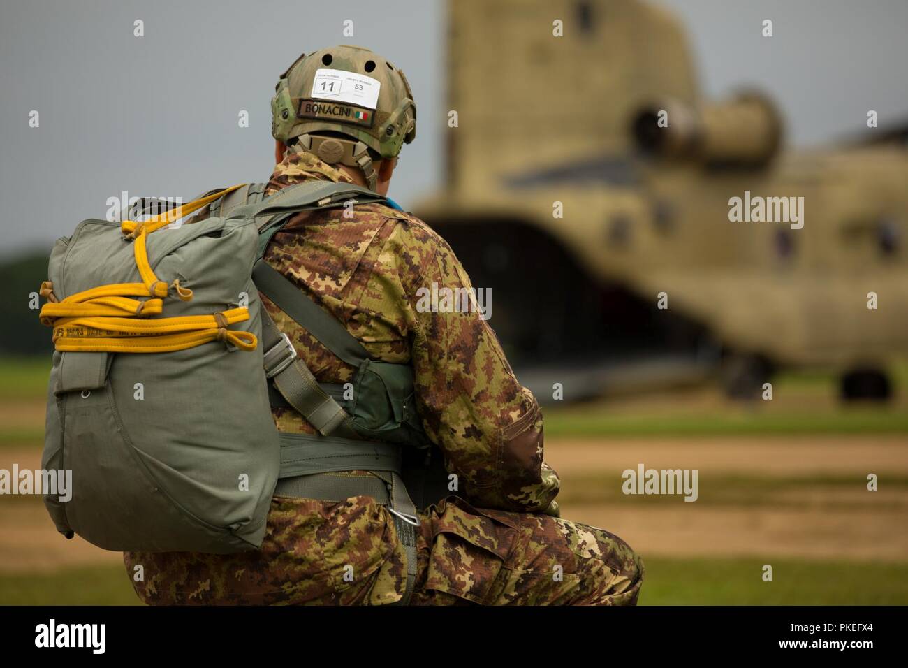 Italian paratrooper Sgt. Bonacini waits to board a CH-47 Chinook during ...