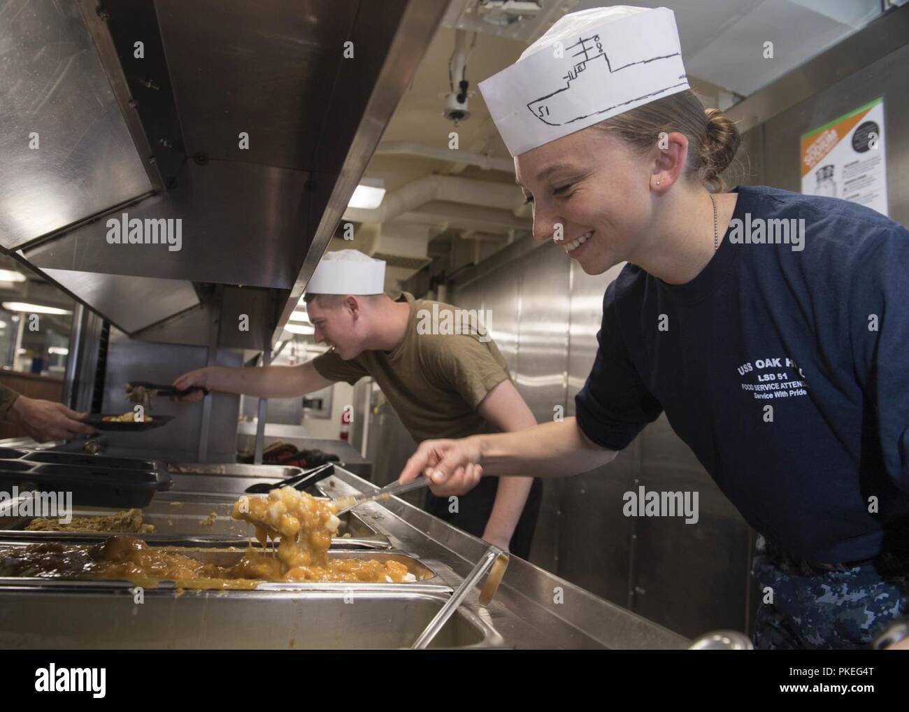 OCEAN (Aug. 1, 2018) Seaman Emily Haley serves in the galley aboard the ...