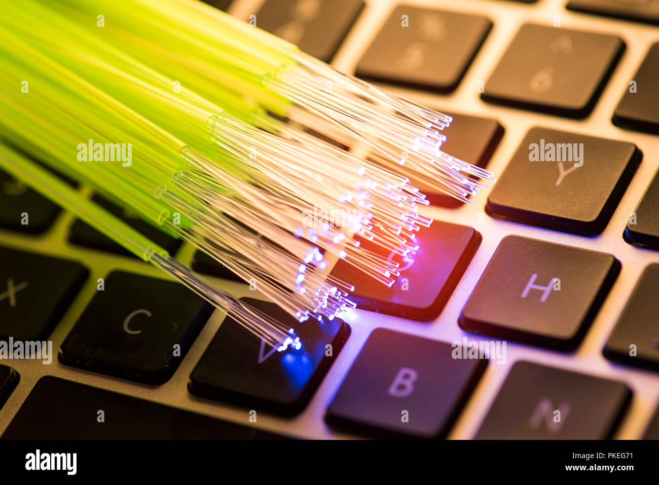 fiber optical on computer keyboard background Stock Photo - Alamy