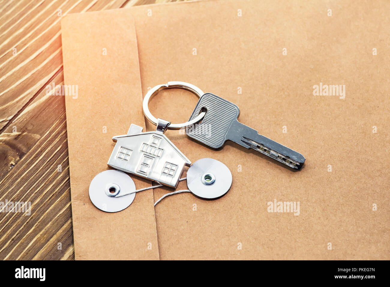 key chain with house symbol and key,Real estate concept Stock Photo - Alamy