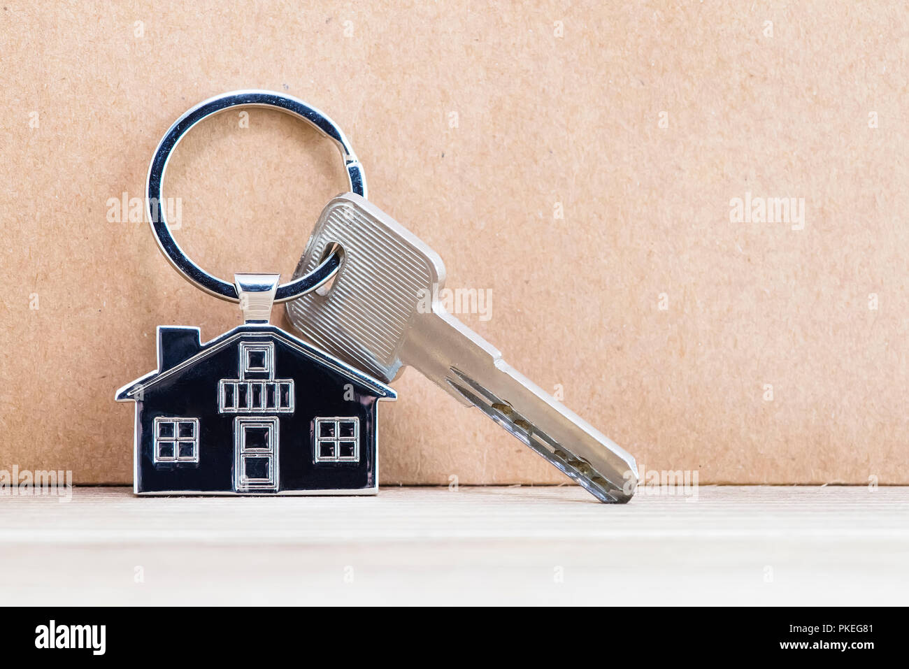 key chain with house symbol and key,Real estate concept Stock Photo - Alamy