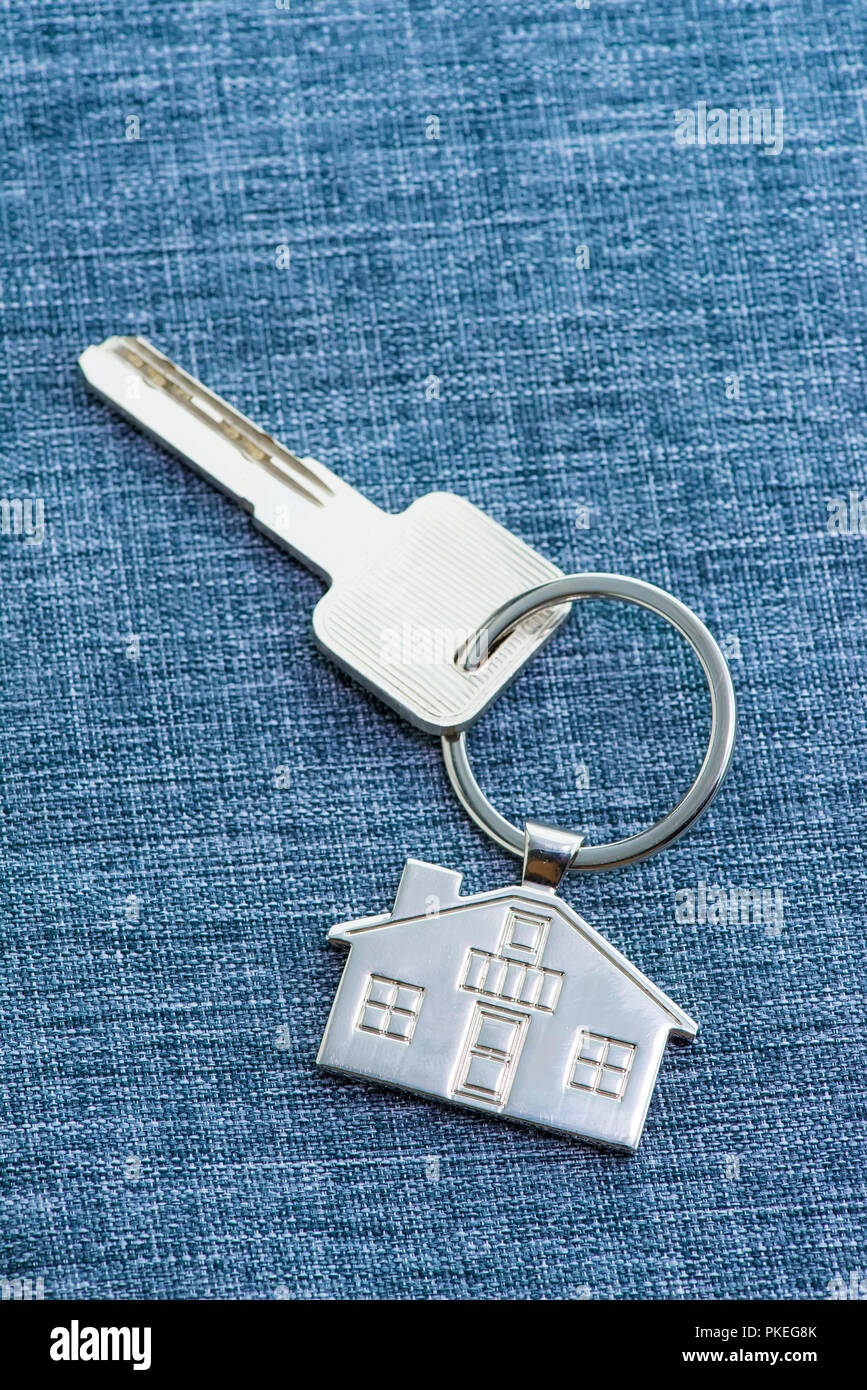 key chain with house symbol and key,Real estate concept Stock Photo - Alamy
