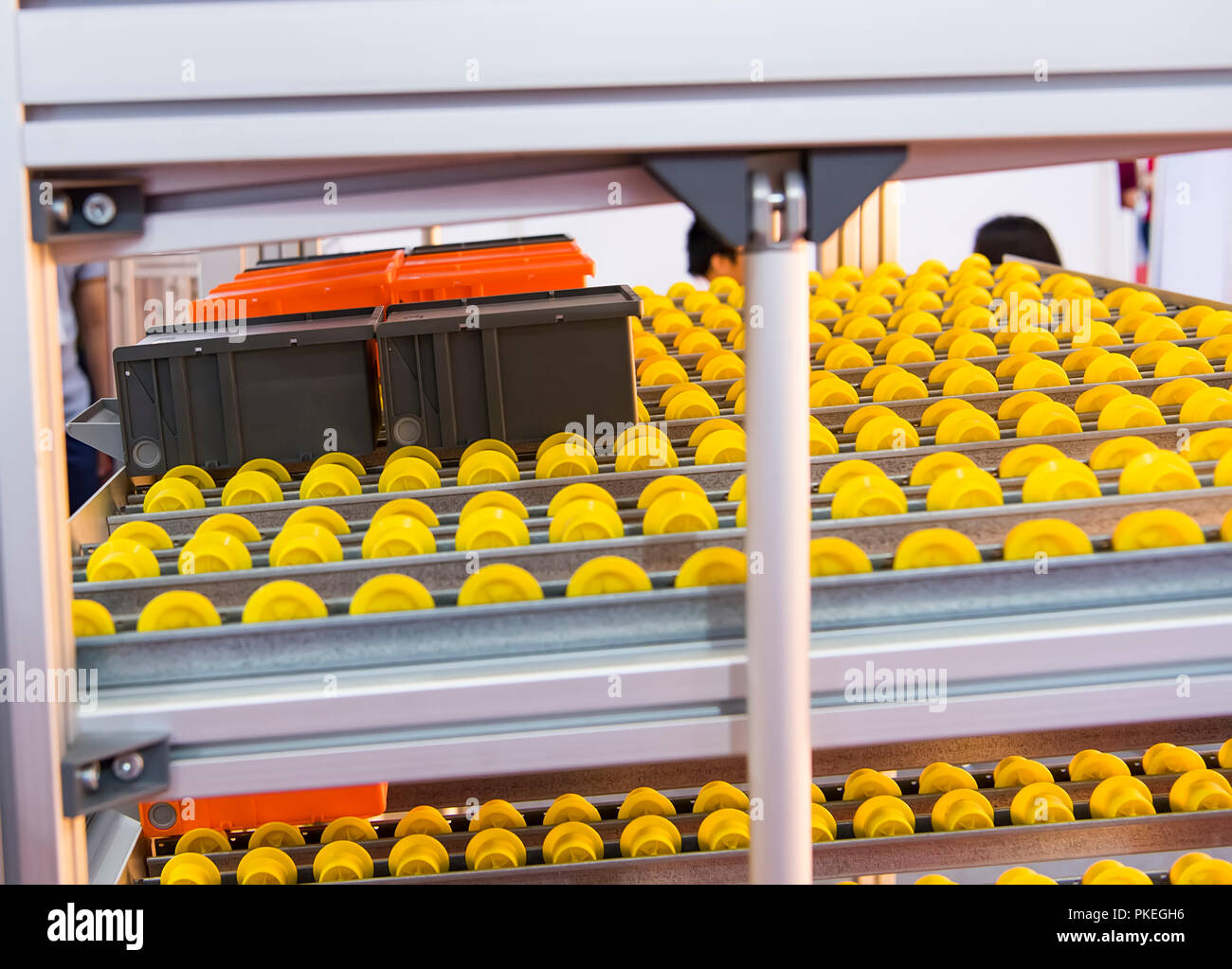 Plastic boxes on the roller conveyor. Modern warehouse equipment Stock ...