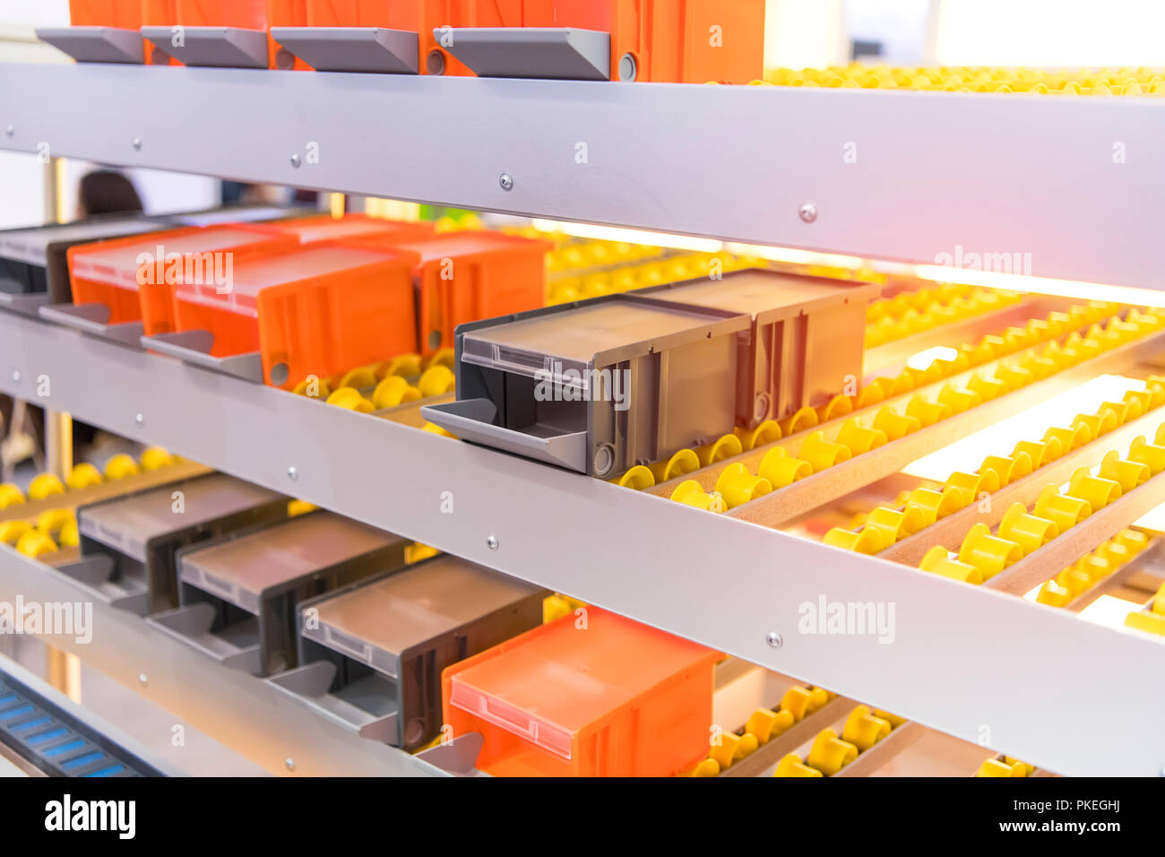 Plastic boxes on the roller conveyor. Modern warehouse equipment Stock ...