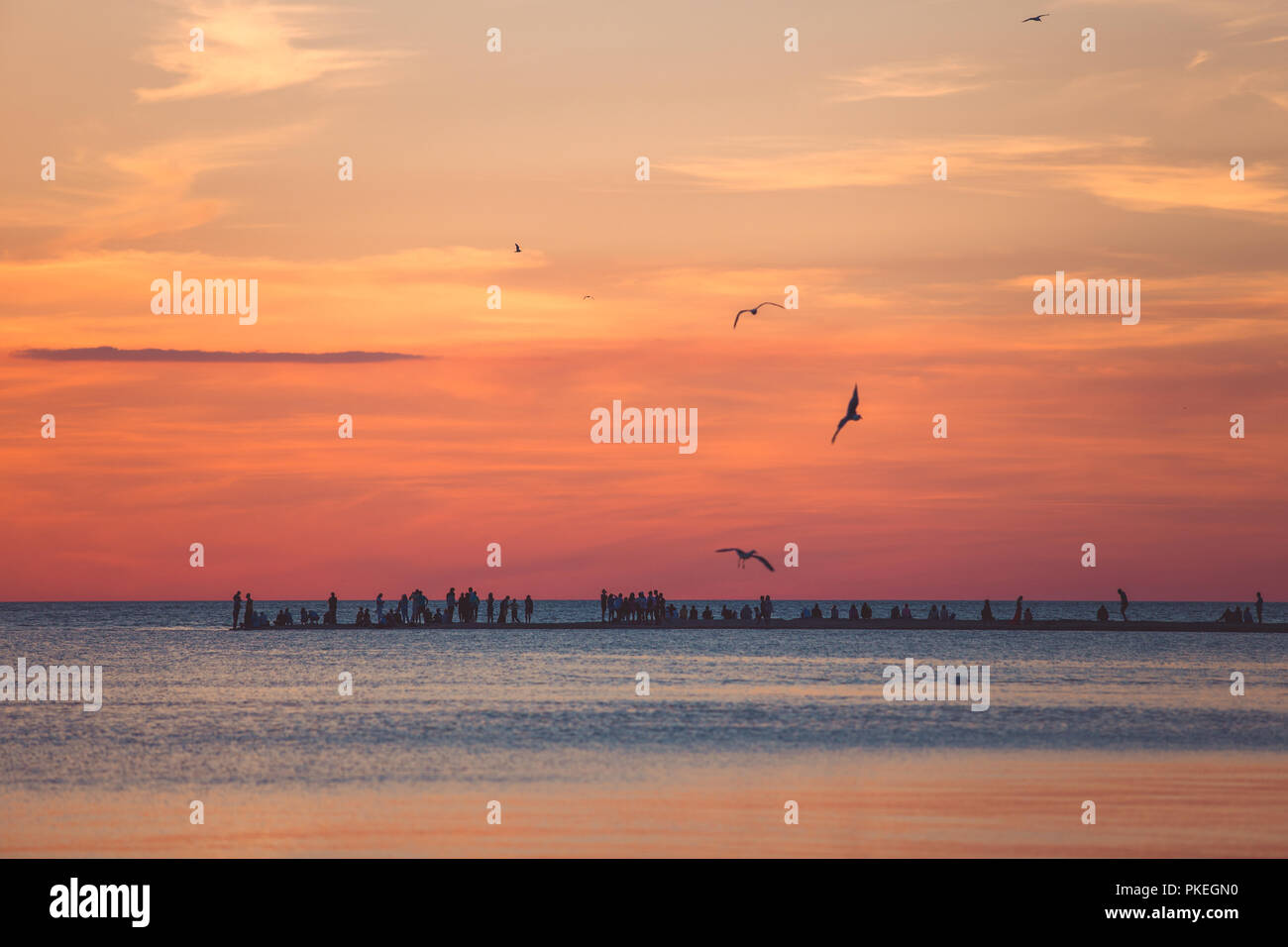 Beautiful seascape with people watching the sunset over the sea Stock ...