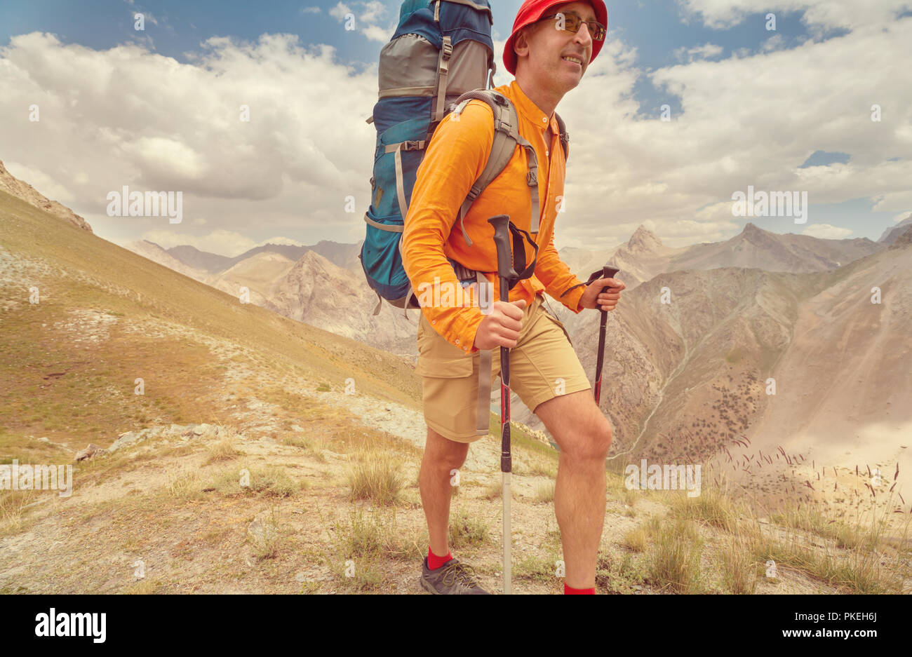 Wanderlust time. Man hiking in beautiful Fann mountains in Pamir ...
