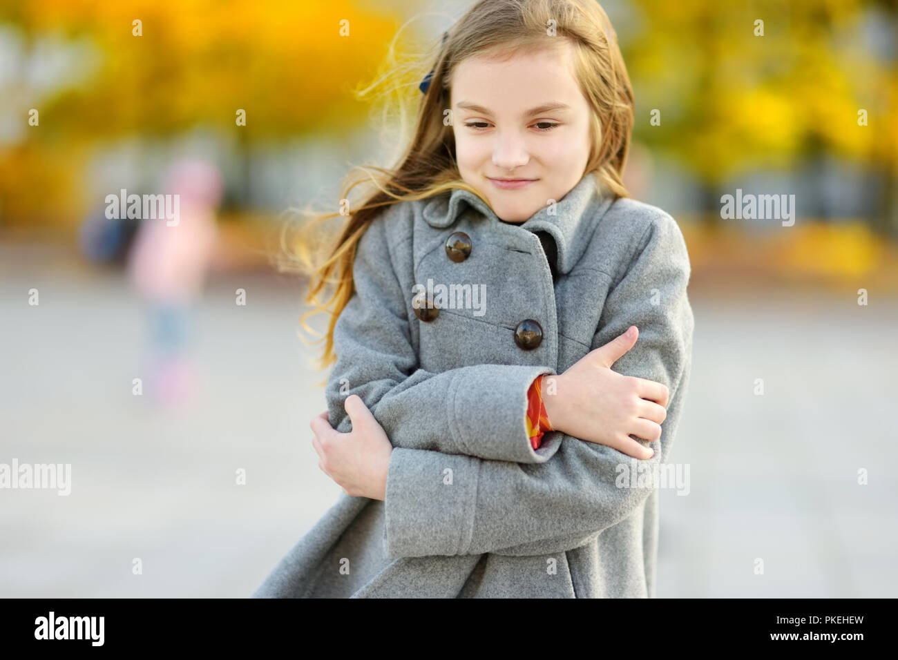 Cute little girl having fun on beautiful autumn day. Happy child ...