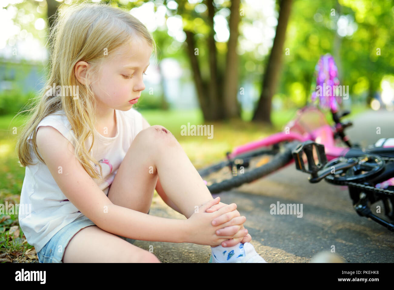 Child falling off bike hi-res stock photography and images - Alamy