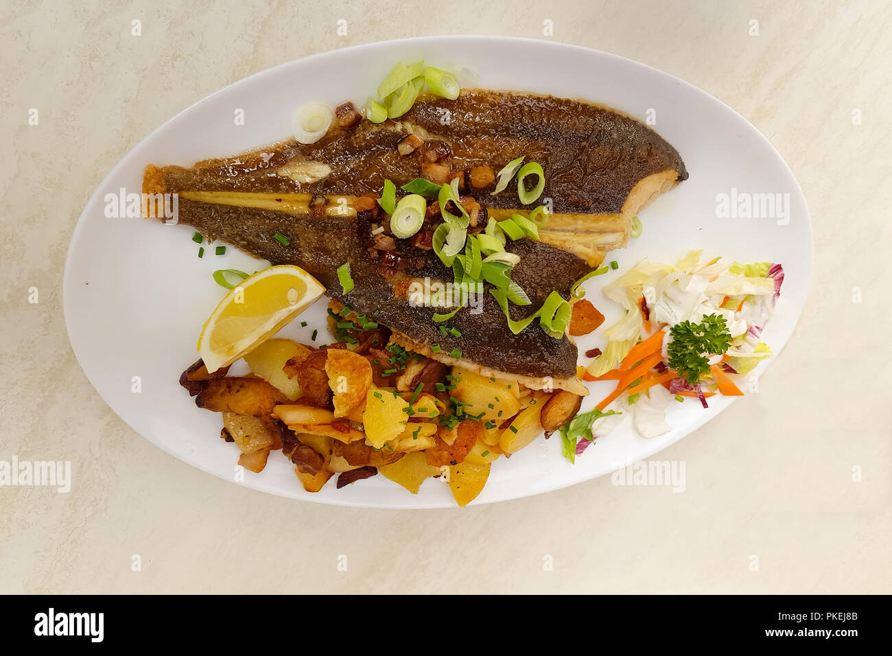Fish dish-fried fish Plaice fillet and vegetables with fried potatoes ...