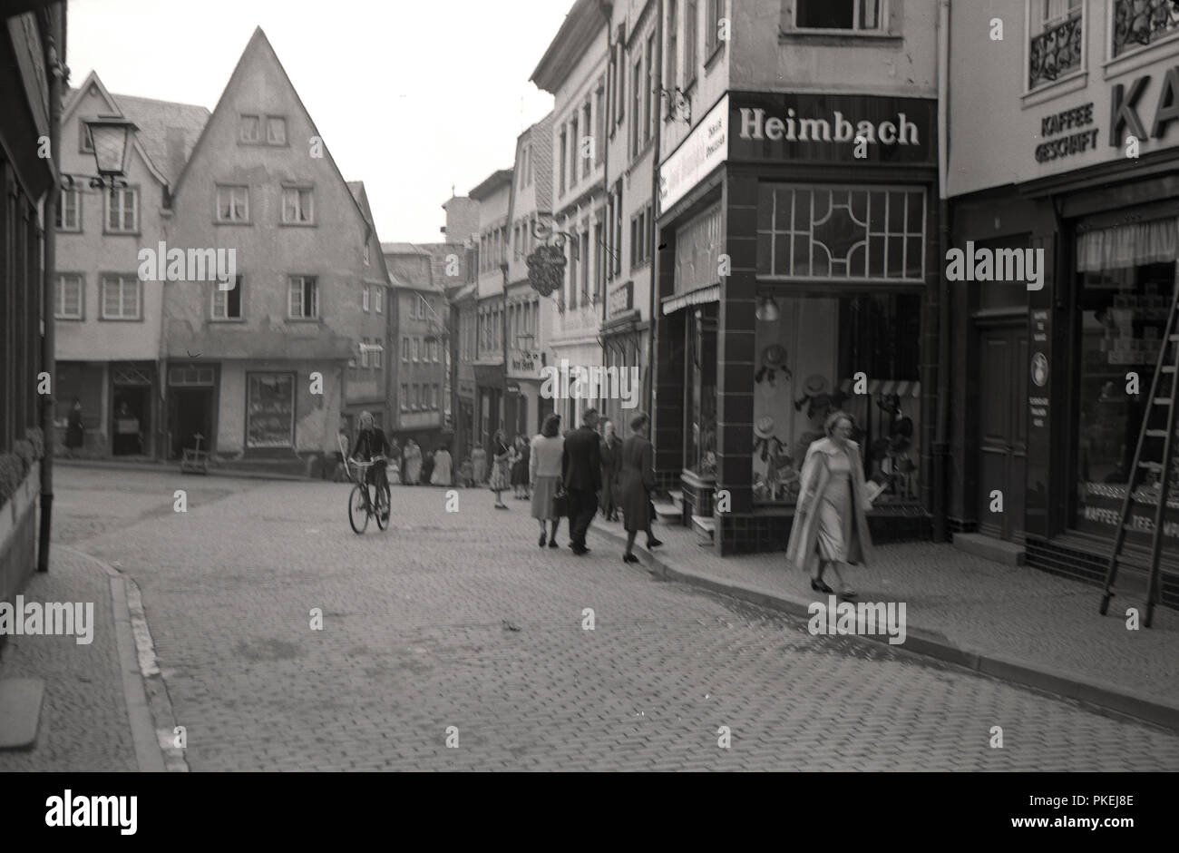 1950s, historical, post-war and a cobbled street in the old town of ...