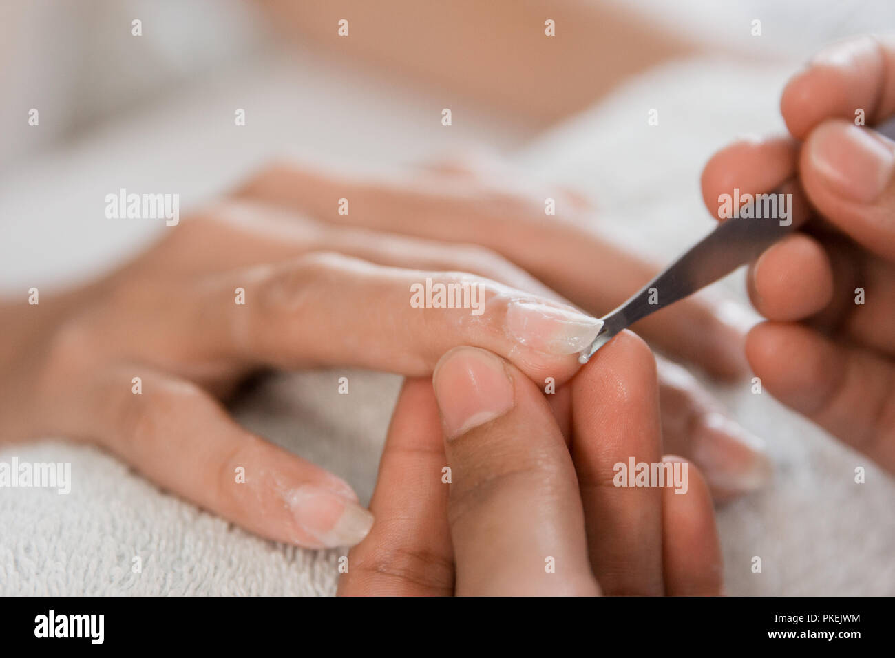 Beautician giving manicure treatment hi-res stock photography and ...
