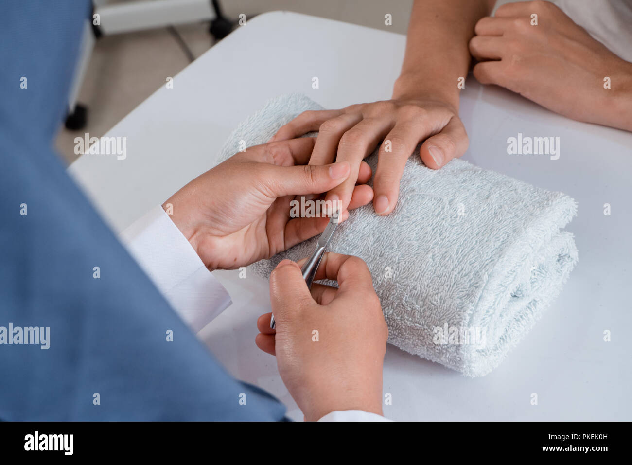 Hand manicure with nail clipper Stock Photo - Alamy
