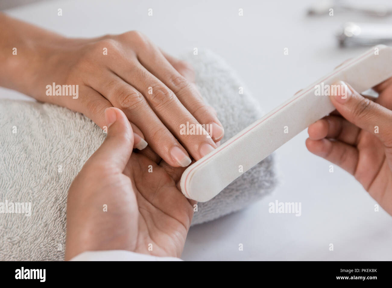 Young woman is getting manicure Stock Photo - Alamy