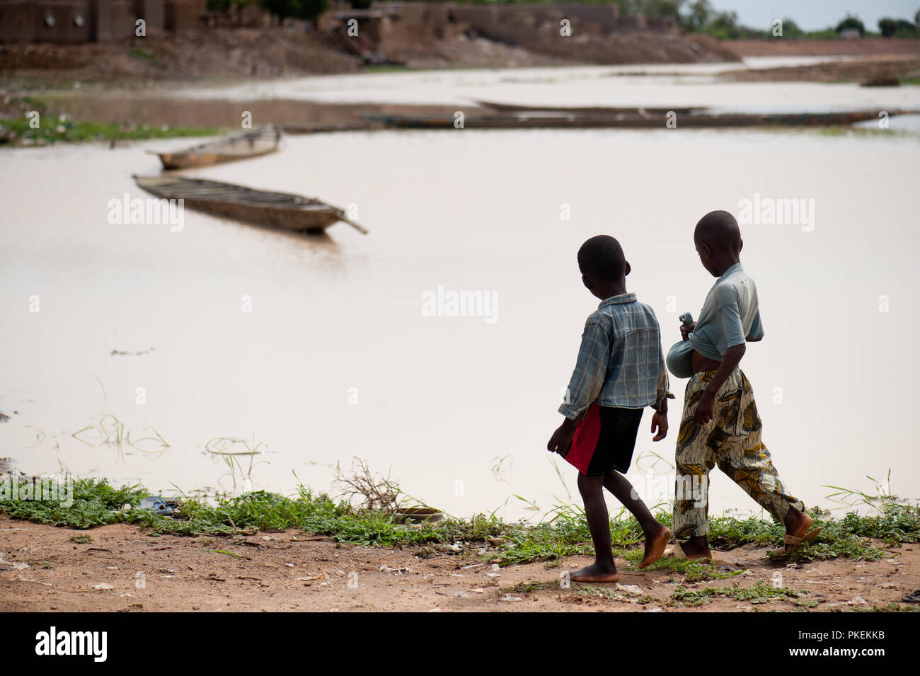 Mali, Africa - circa August 2009 - Two black african friends walking ...
