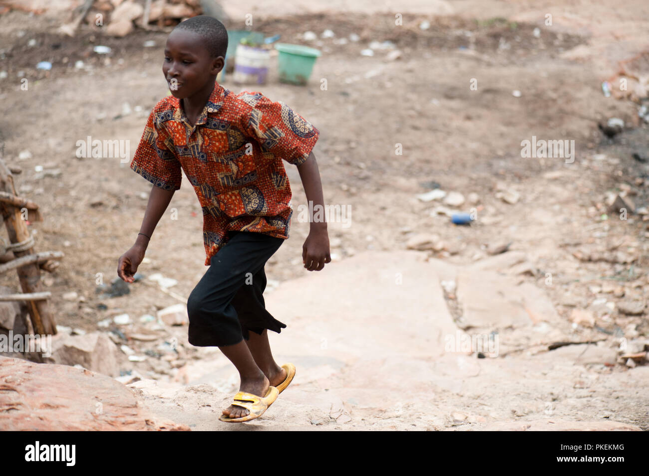 Mali, Africa - circa August 2009 - Black african boy walking happy ...