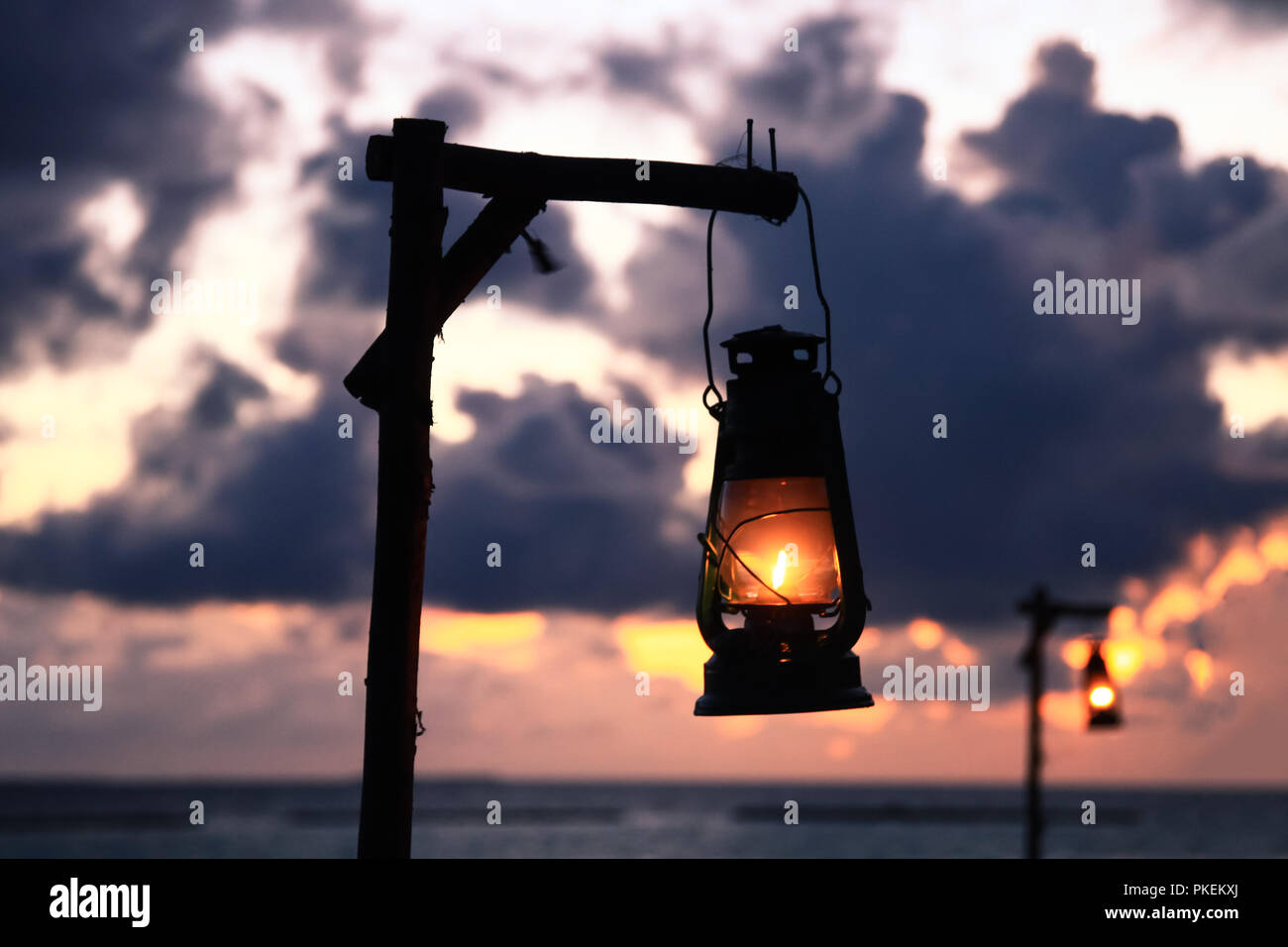 Beach Oil Lamp Lighting and Pacific Ocean at Dusk in Maldives Island ...