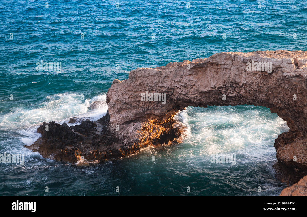 Stone arch known as the Love bridge. Natural landmark of Mediterranean ...