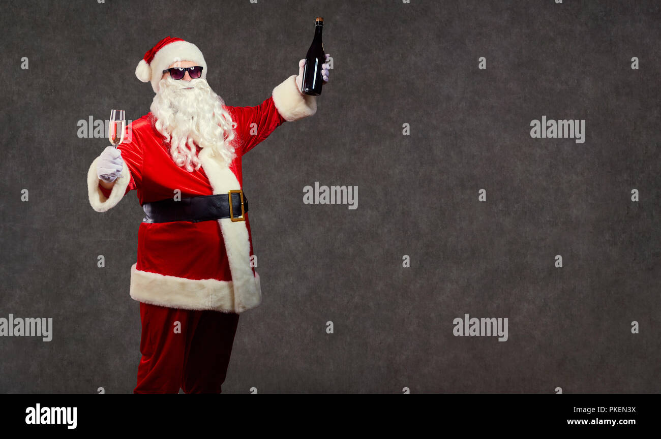 Santa Claus with a glass of champagne Stock Photo - Alamy
