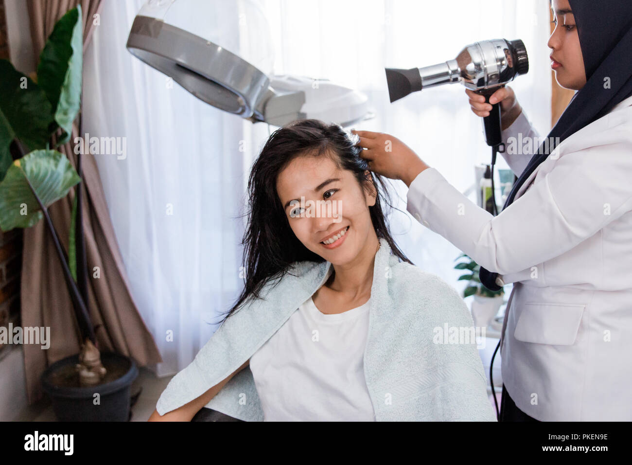 woman hair drying after wash her hair Stock Photo - Alamy