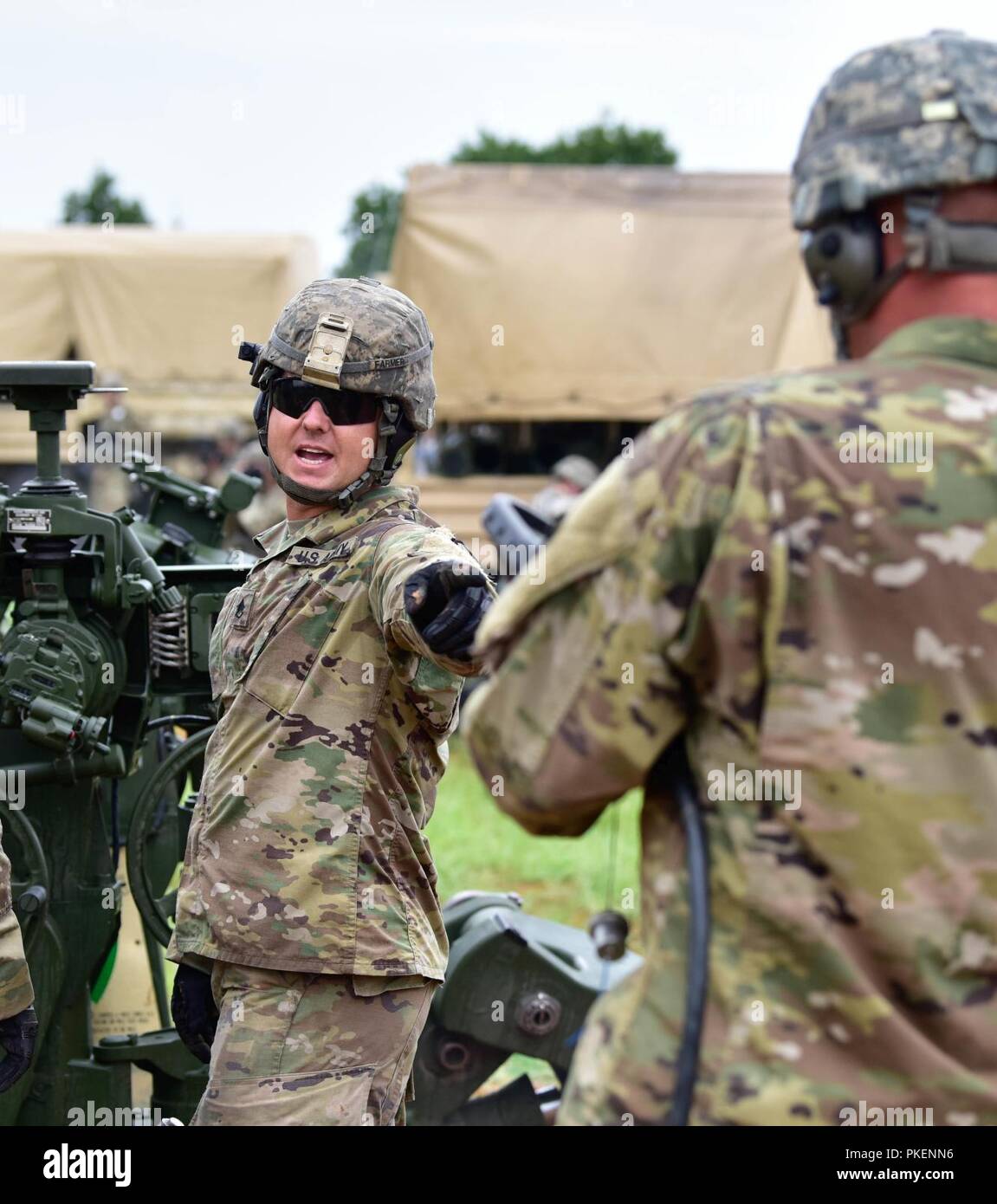Staff Sergeant Blake Farmer, a Soldier assigned to Charlie Battery, 1st ...