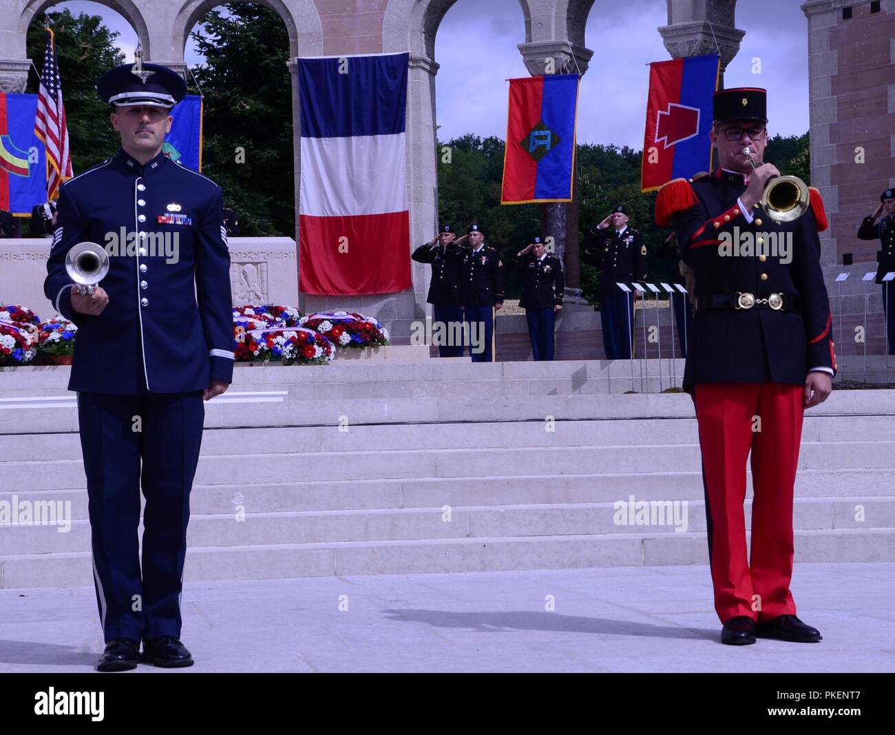 A United States Air Force bugler stands at attention while his Frenchy ...