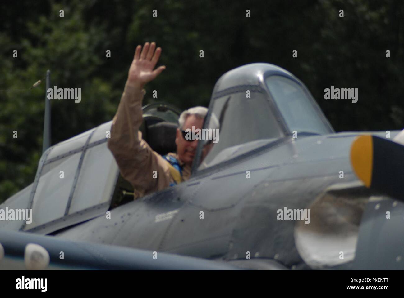 Pilot Mike Spalding waves to the crowd from an airworthy Grumman FM-2 ...