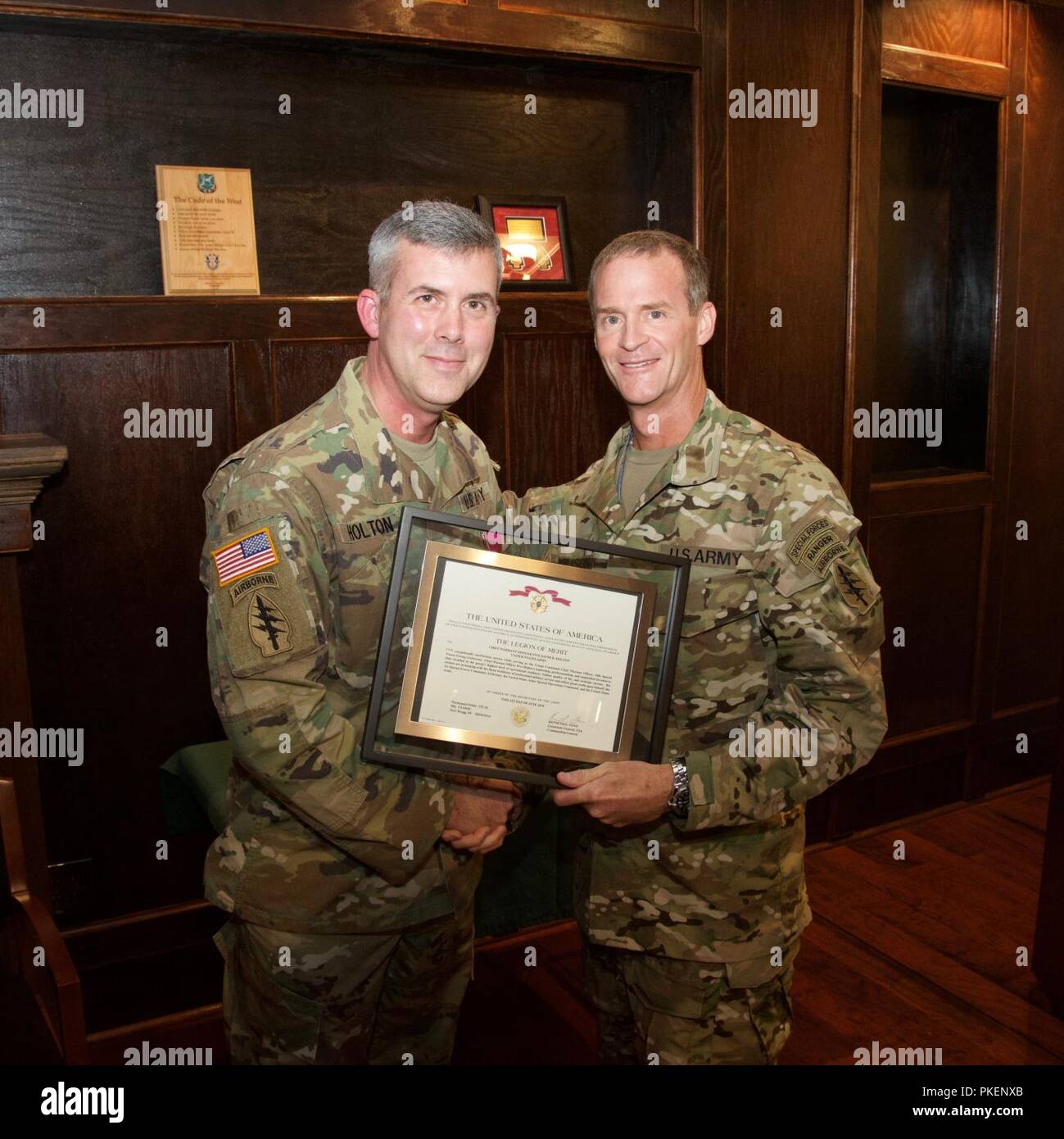Col. Lawrence G. Ferguson, 10th Special Forces Group (Airborne) commander, presents Chief ...