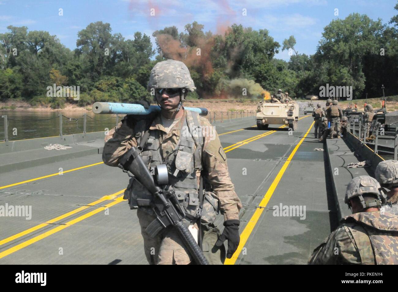 A Soldier from the 420th Engineer Brigade transports gear across the ...