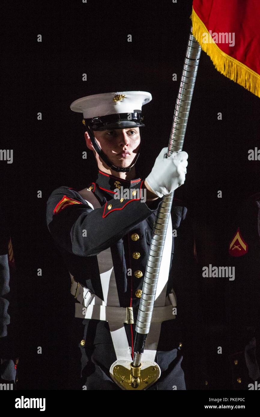 A Marine with the U.S. Marine Corps Color Guard carries the Marine ...