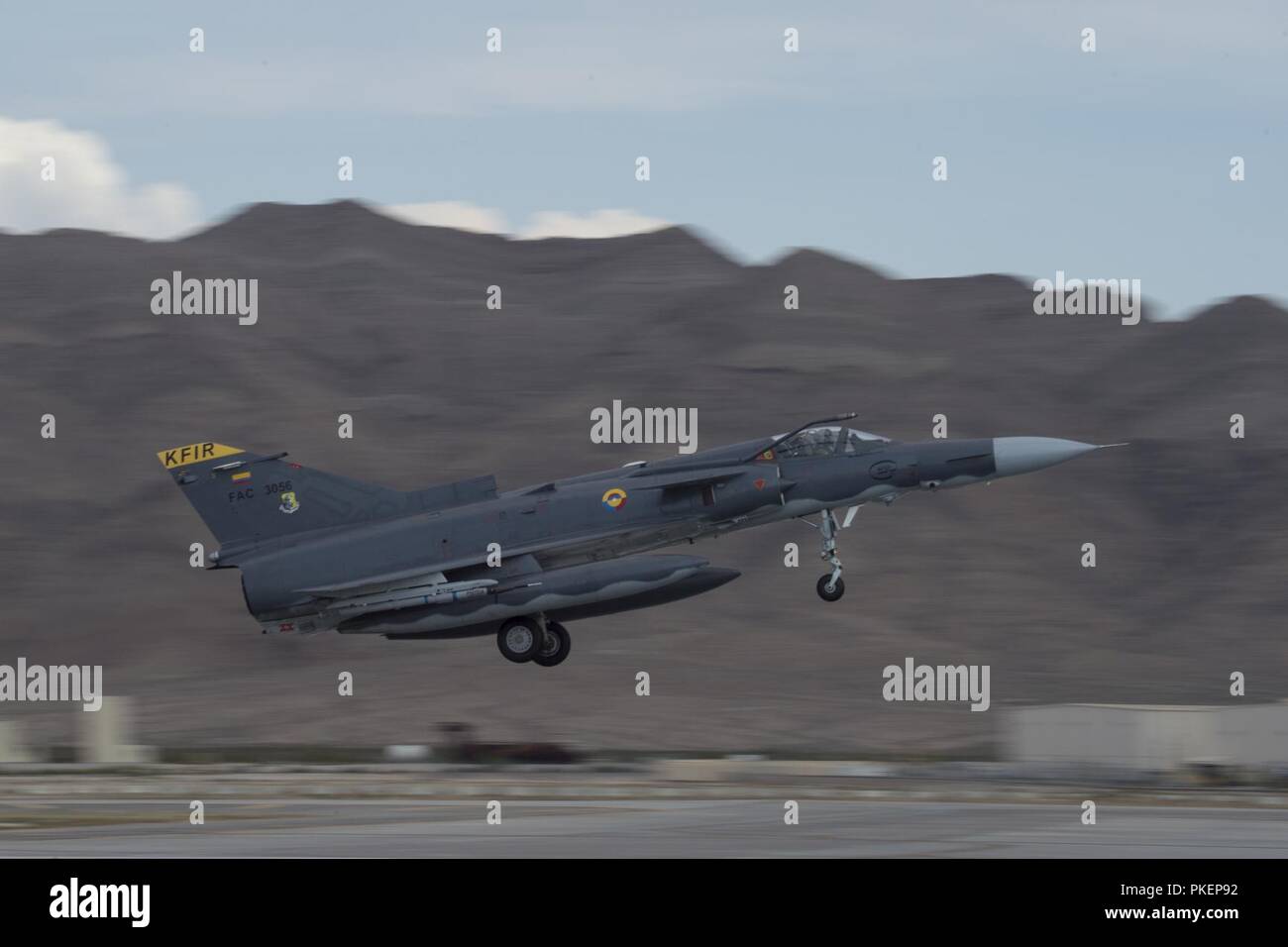 A Colombian Air Force Kfir figter jet lands on the flightline at Nellis ...