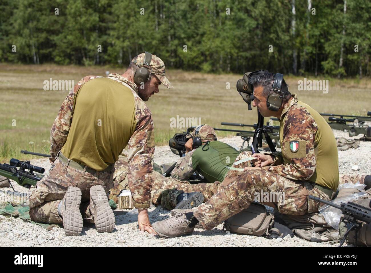 An Italian sniper team discusses collected data on the Data of Previous ...