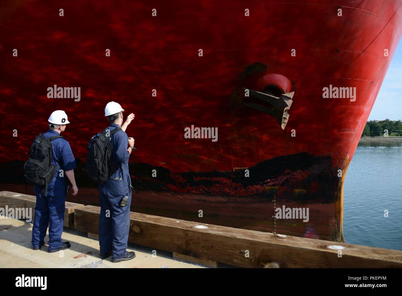 Members of U.S. Coast Guard Sector Boston's Prevention Team examine the ...