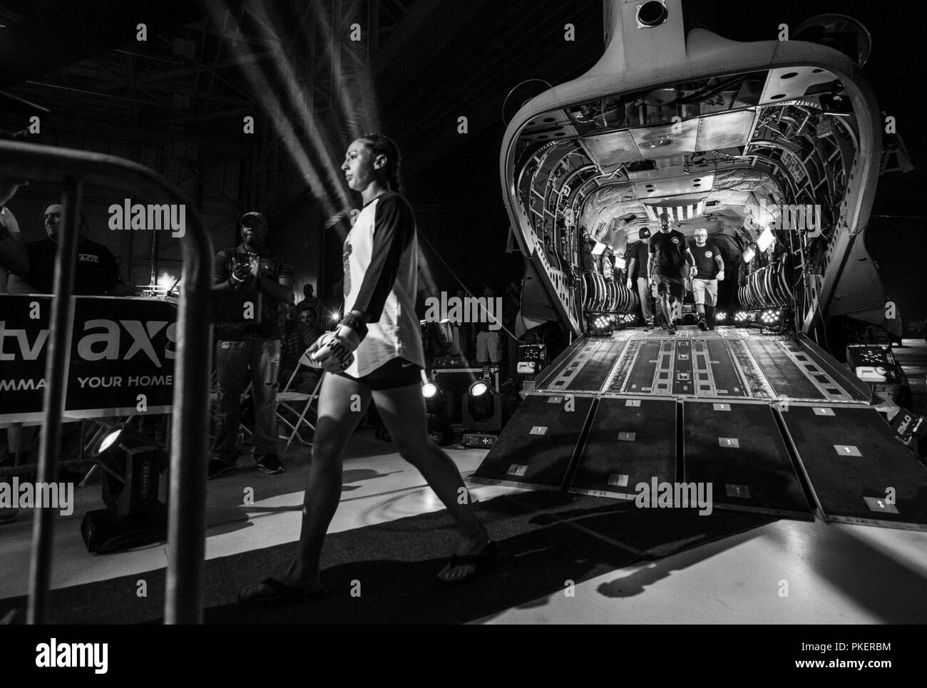 Left, Salina Rowland, mixed martial arts athlete, approaches the ...