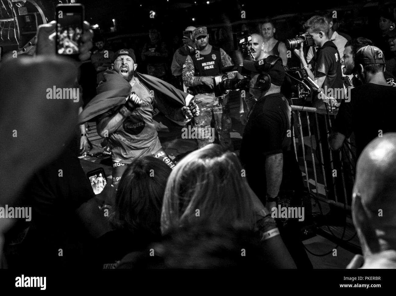 Center, Kyle "Gunz Up" Stewart, mixed martial arts athlete, approaches ...