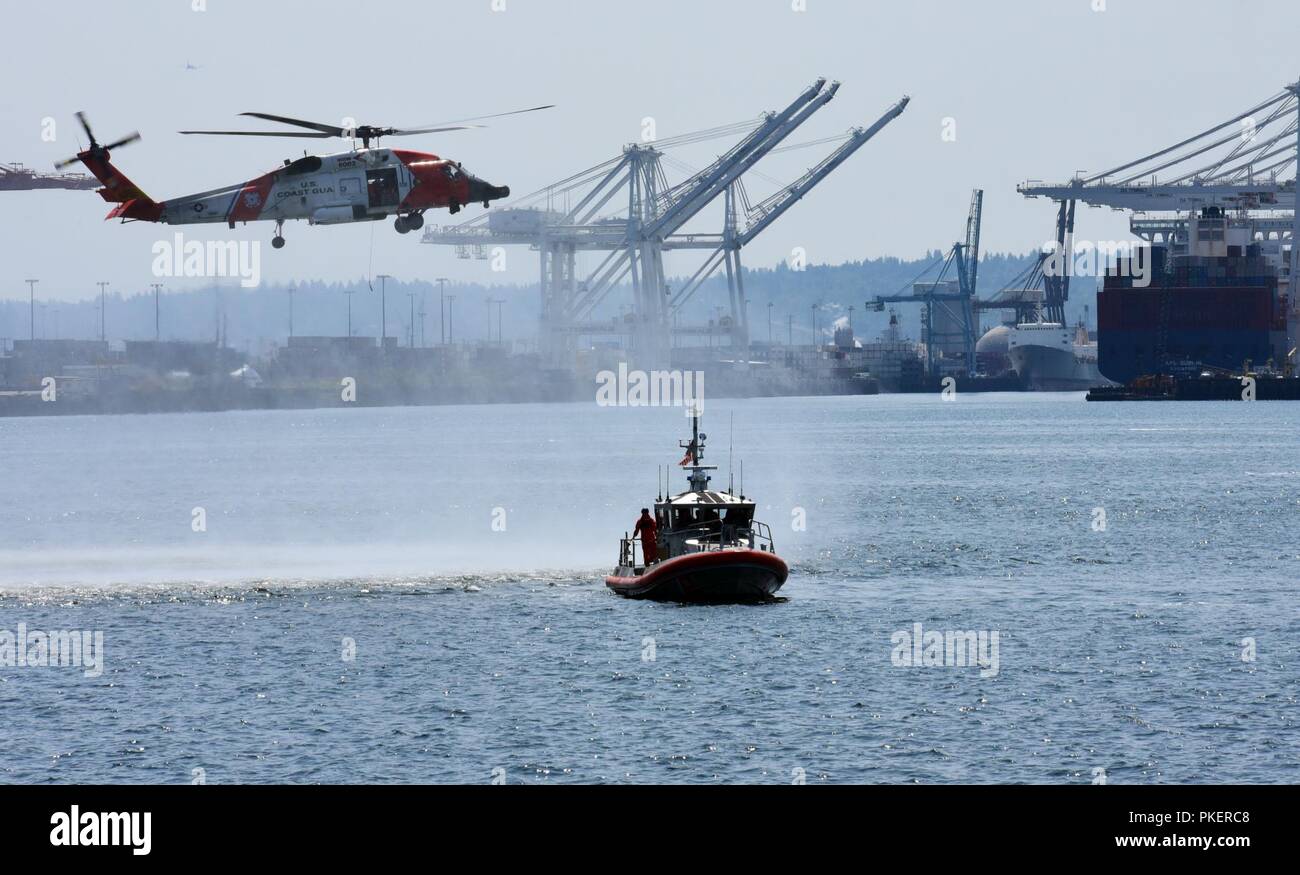 A Coast Guard Sector Columbia River MH-60 Jayhawk helicopter crew ...