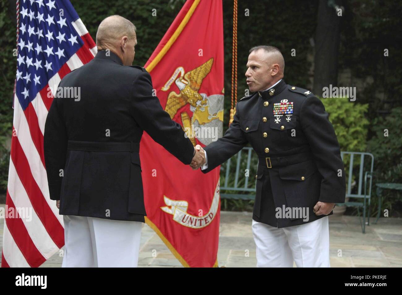 Commandant of the Marine Corps Gen. Robert B. Neller, left, shakes ...