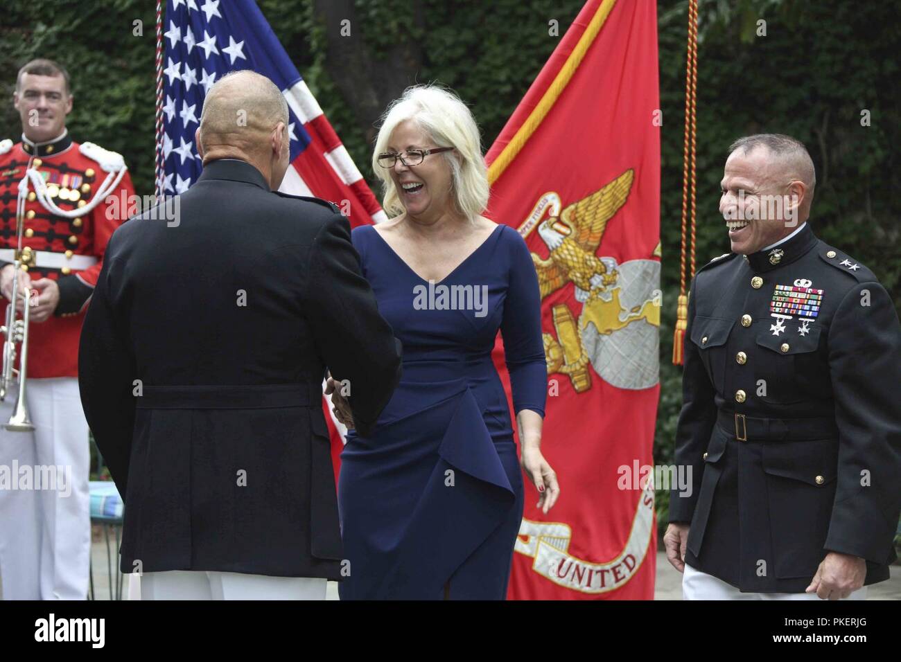 Jean Kilker, wife of Maj. Gen. Daniel J. Lecce, shakes hands with the ...