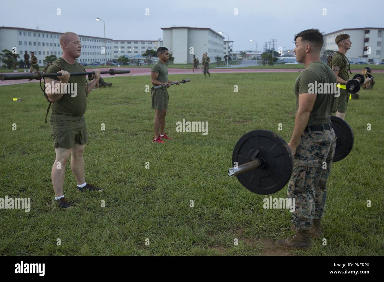 Sgt. Ronald M. Gay teaches Marines the proper forms for a curling ...