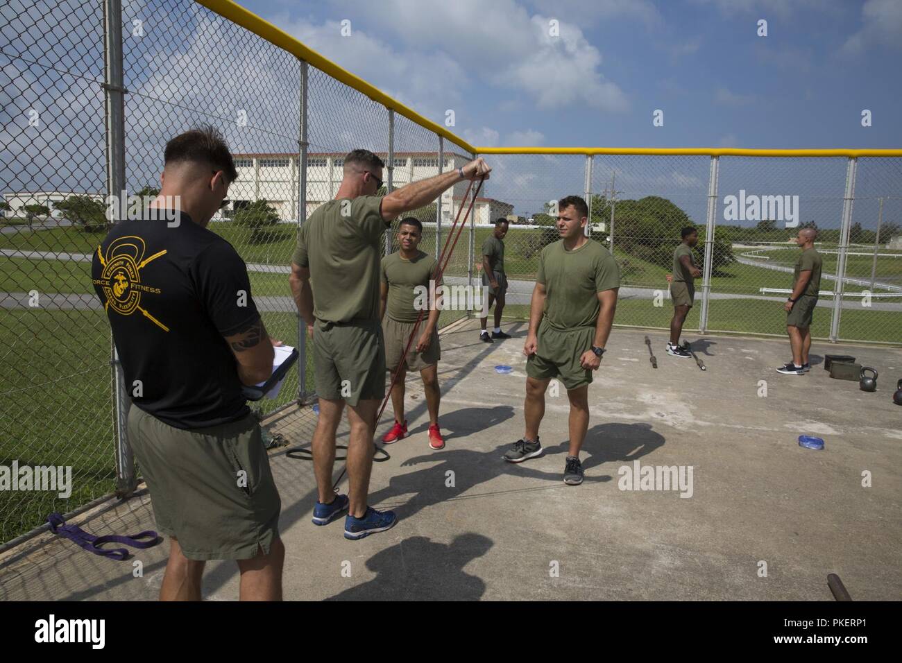 Staff Sgt. Anatoly N. Ray evaluates Marines on their proper work out ...